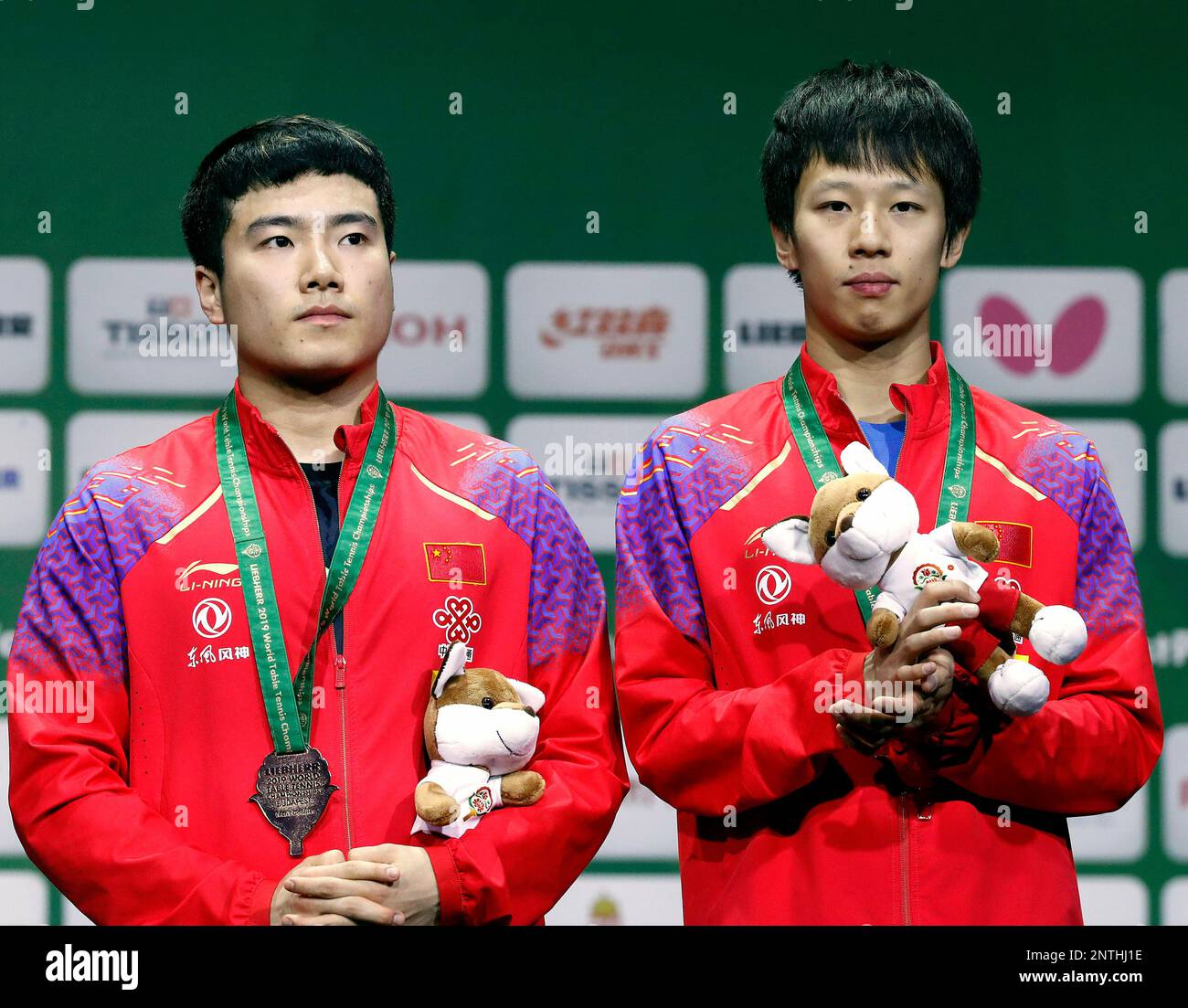 Liang Jingkun, left, and Lin Gaoyuan of China during the award ceremony ...