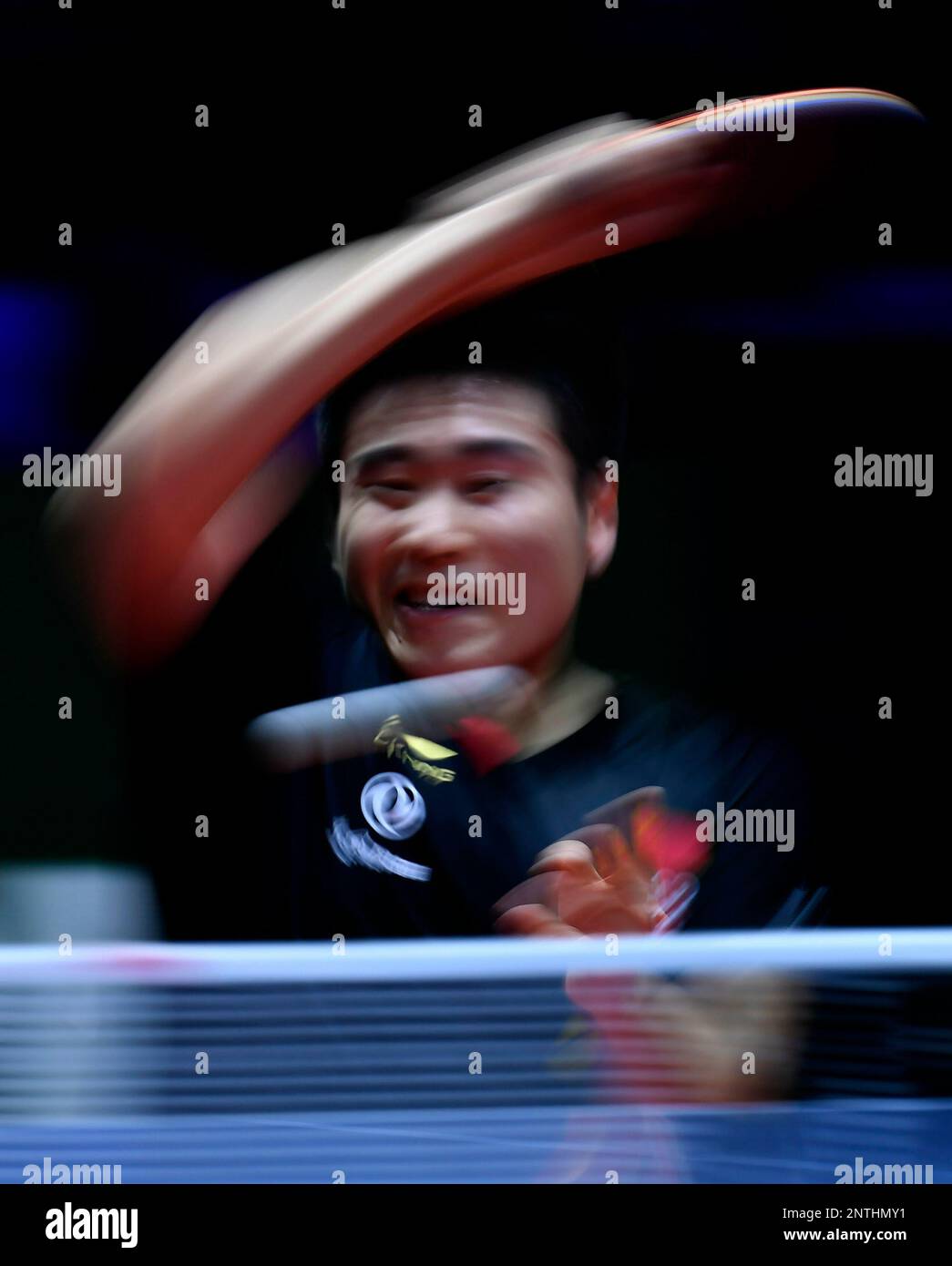 Liang Jingkun of China plays against Niwa Koki of Japan during their ...