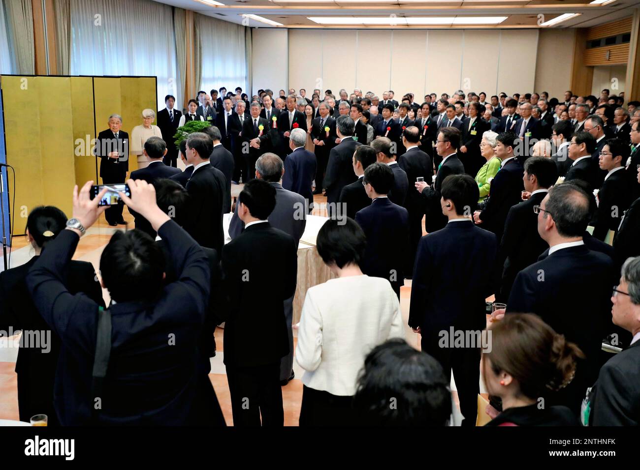 Japanese EmperorAkihito and Empress Michiko make a toast during ...