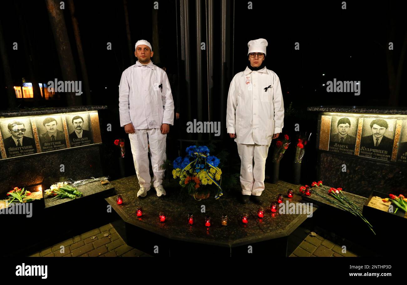 Chernobyl nuclear plant workers in uniform attend a ceremony to ...