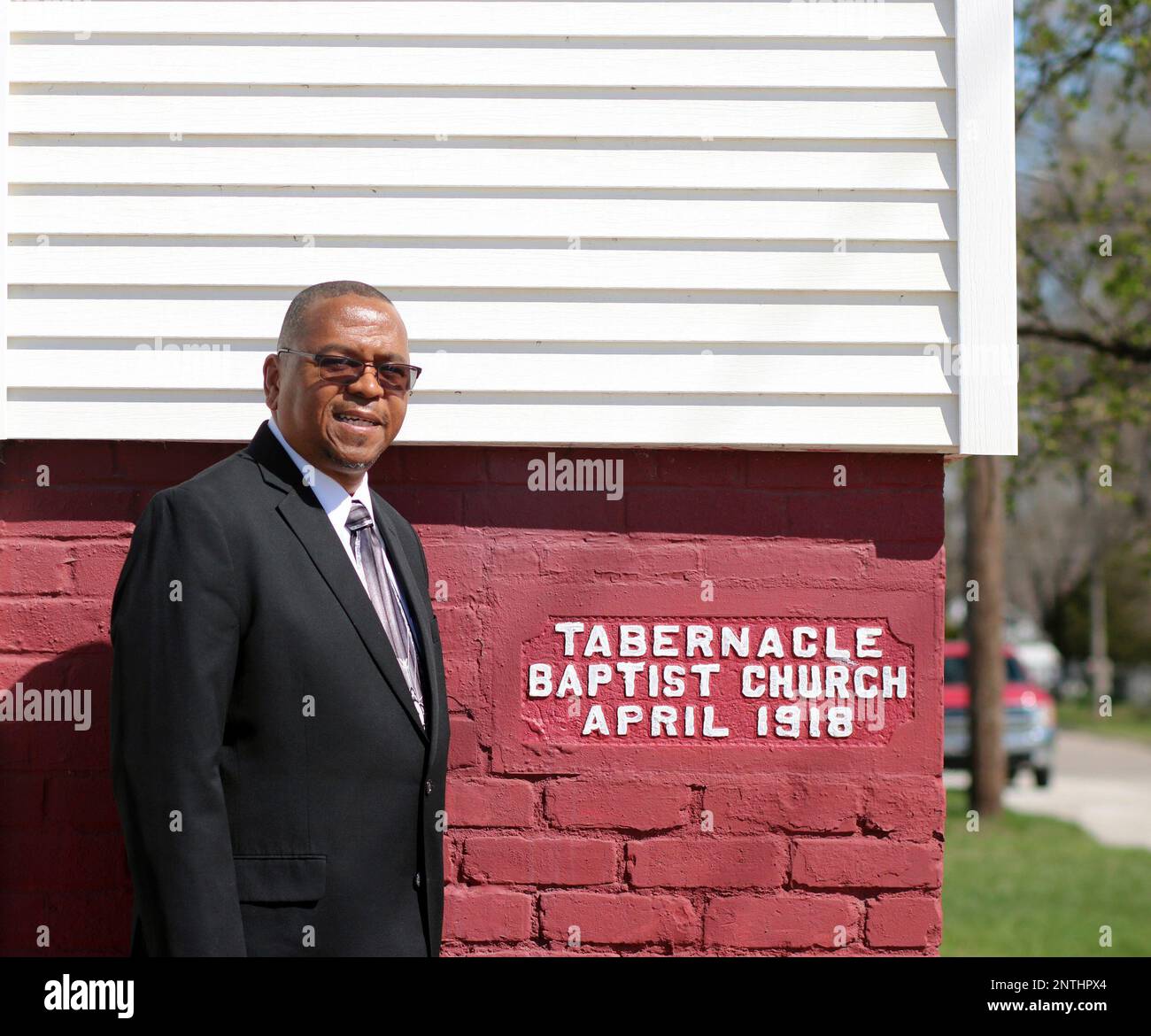 In an April 13, 2019 photo, Rev. Raymond Burt stands in front of ...