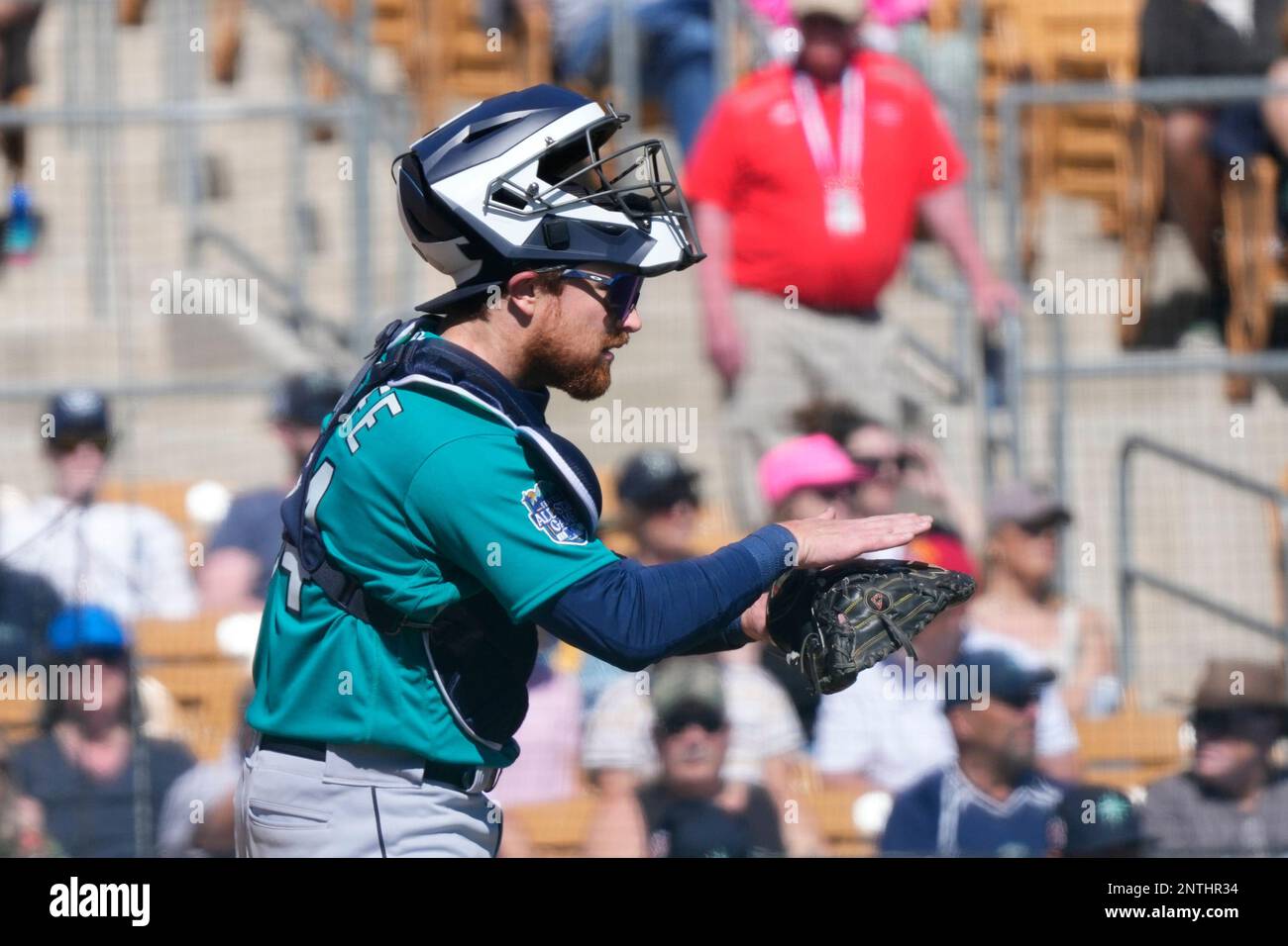 Seattle Mariners catcher Brian O'Keefe signals to infielders during the ...