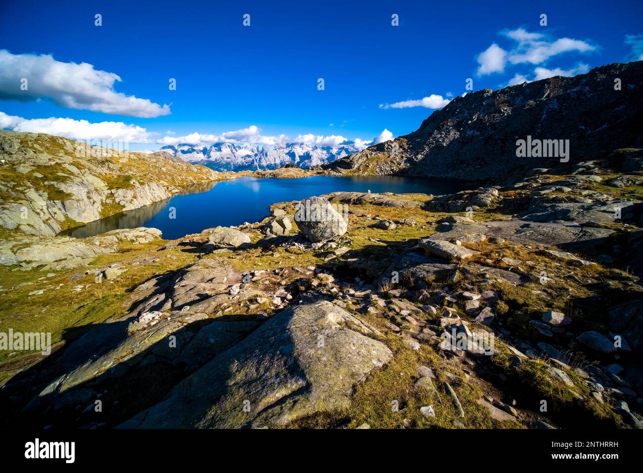 The lake Lago Nero, located on a high plateau, surrounded by rocks and ...
