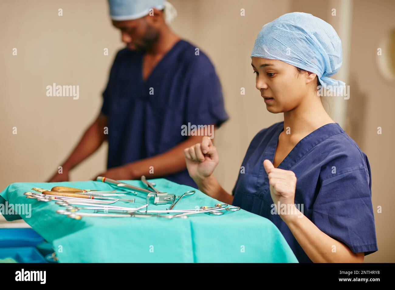Double checking that every surgical instrument is accounted for. a ...