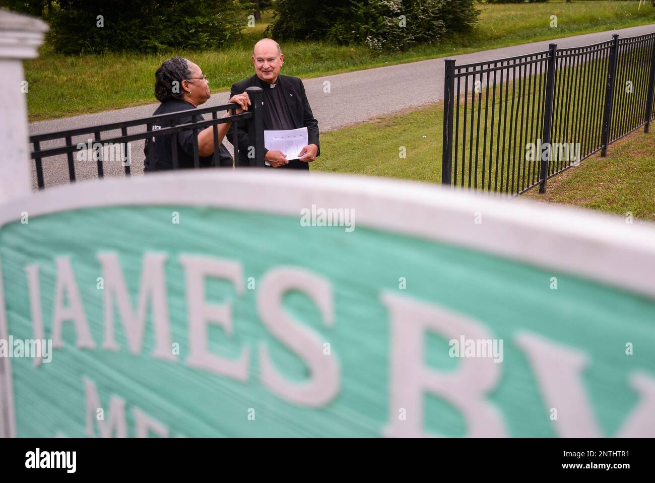 Father Ron Foshage walks with Betty Boatner, a sister of James Byrd Jr ...
