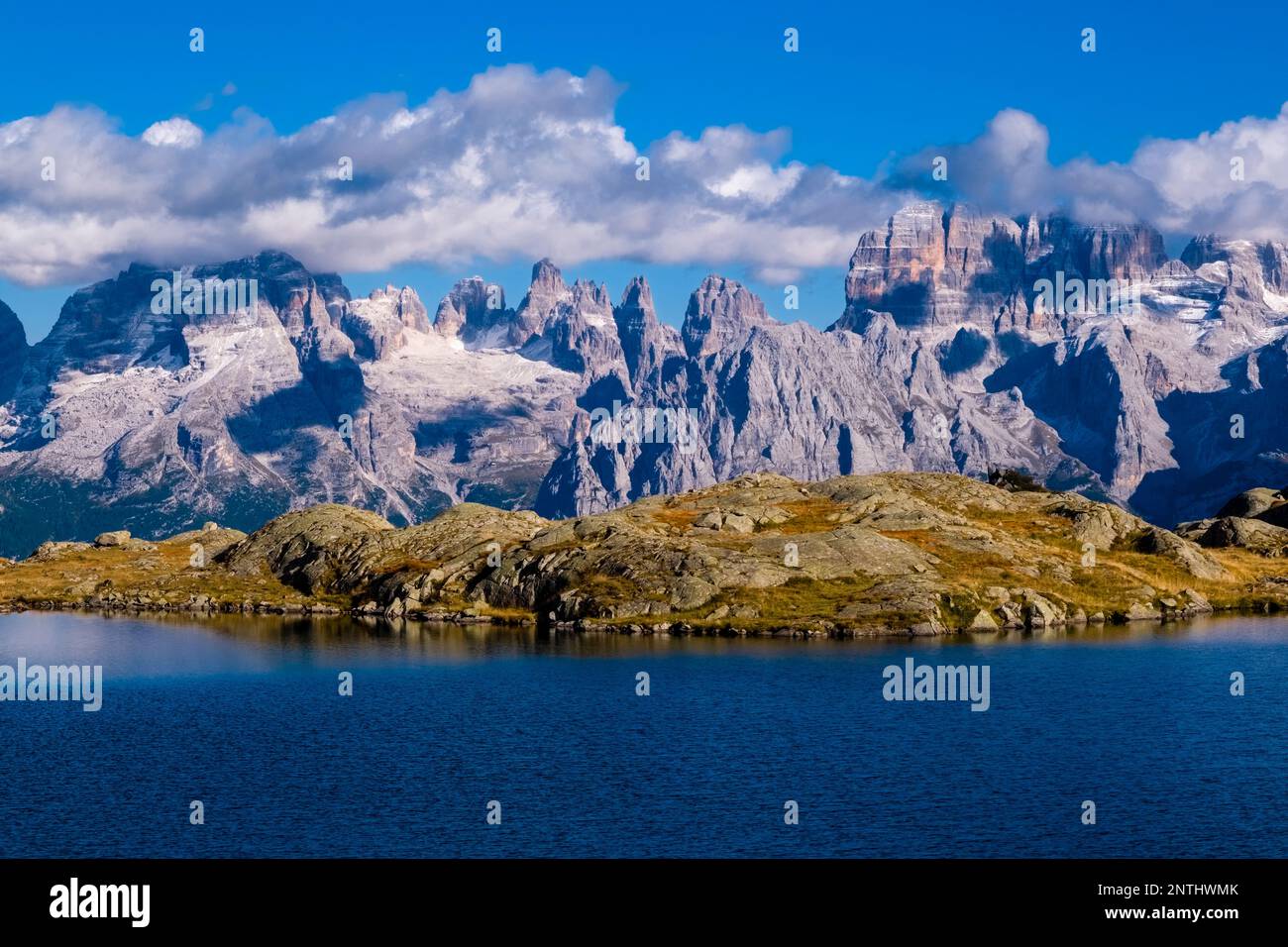 The main range of Brenta Dolomites, rising behind the lake Lago Nero ...