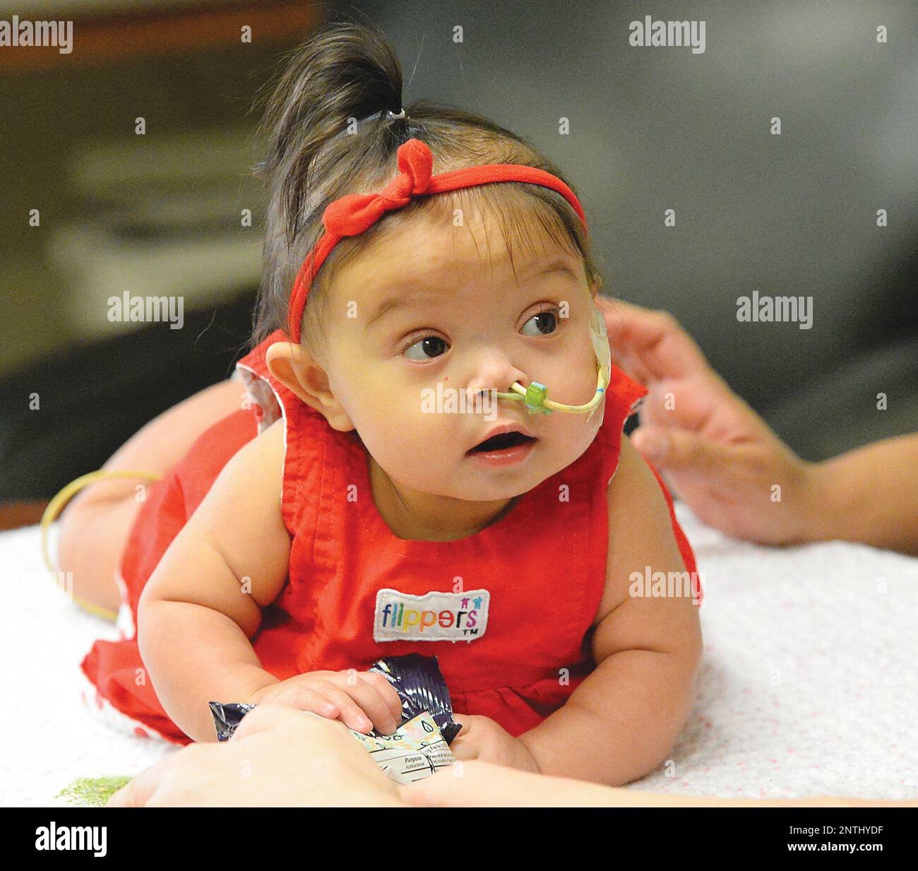 Sheldon Adams has the attention of his nine-month-old daughter Alice ...