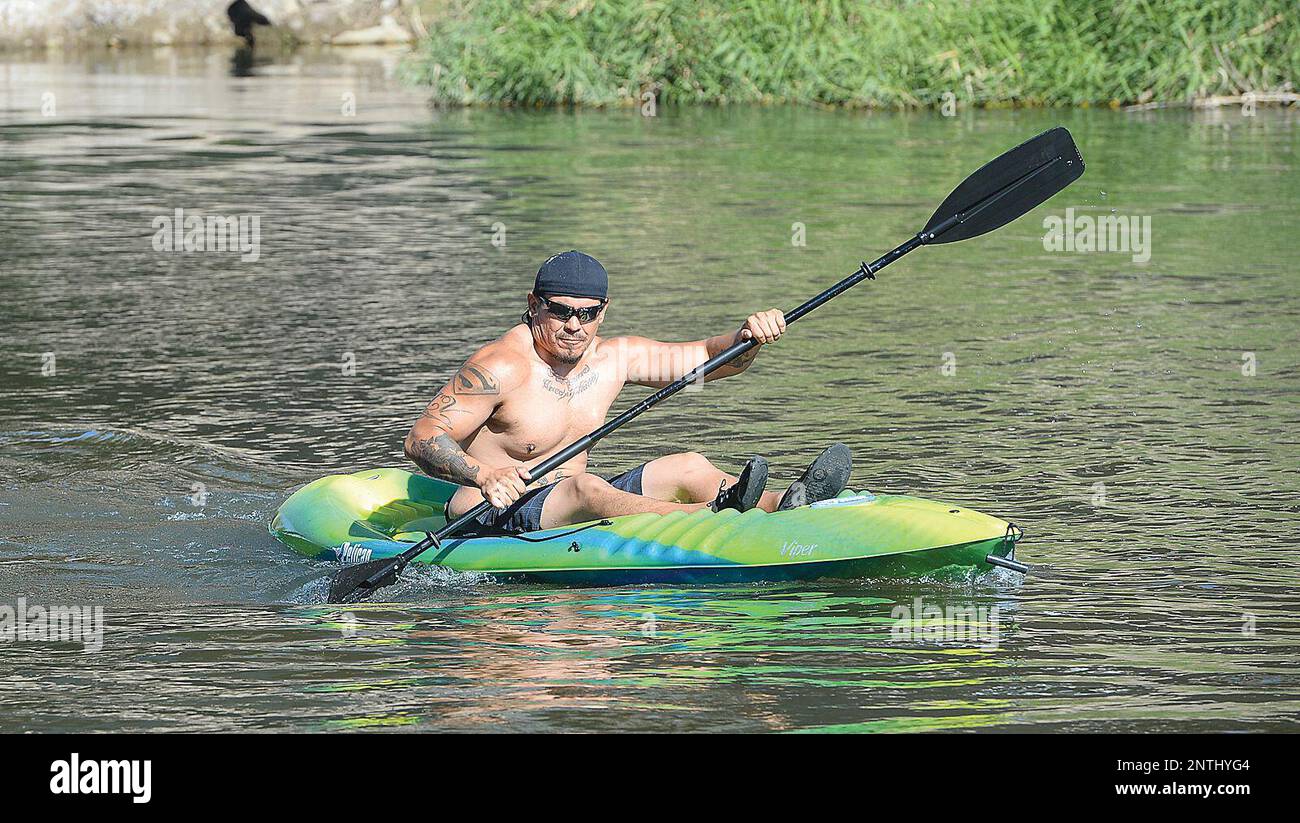 Pete Escalanti paddles hard as he and his brother Mark Escalanti head ...