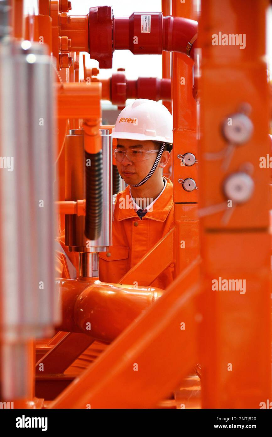 A worker prepares for a ceremony celebrating an advanced electric ...