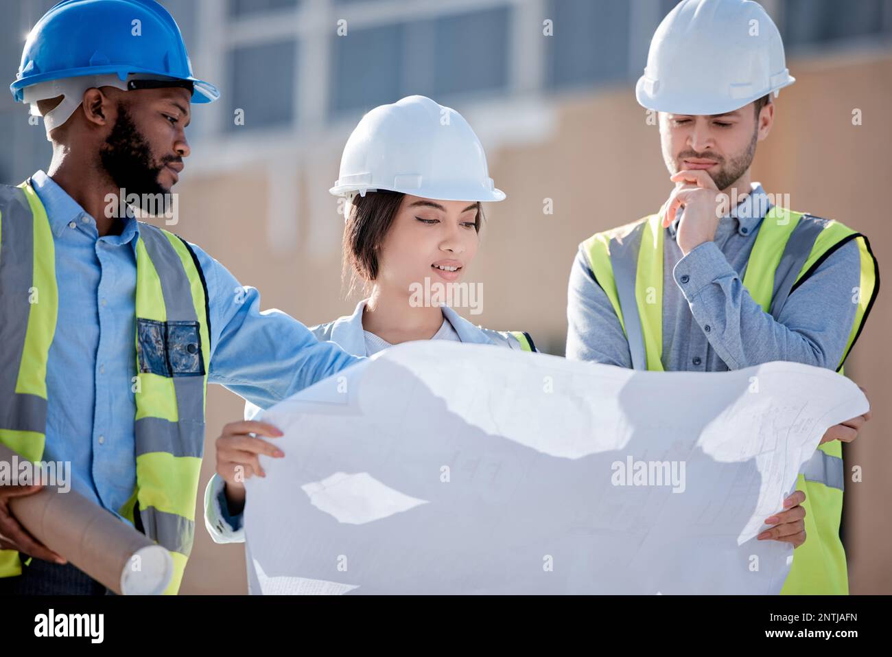 Blueprint, teamwork and engineering with people on construction site ...