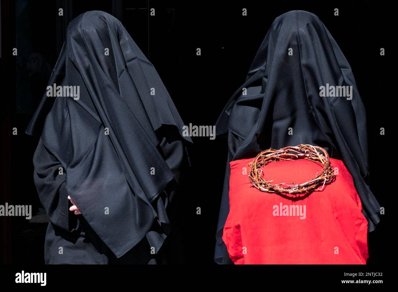 Veiled women known as "Les Pleureuses" or mourning women are covered ...