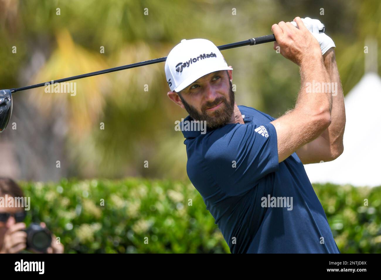 Dustin Johnson tees off on the first hole during the first round at the ...