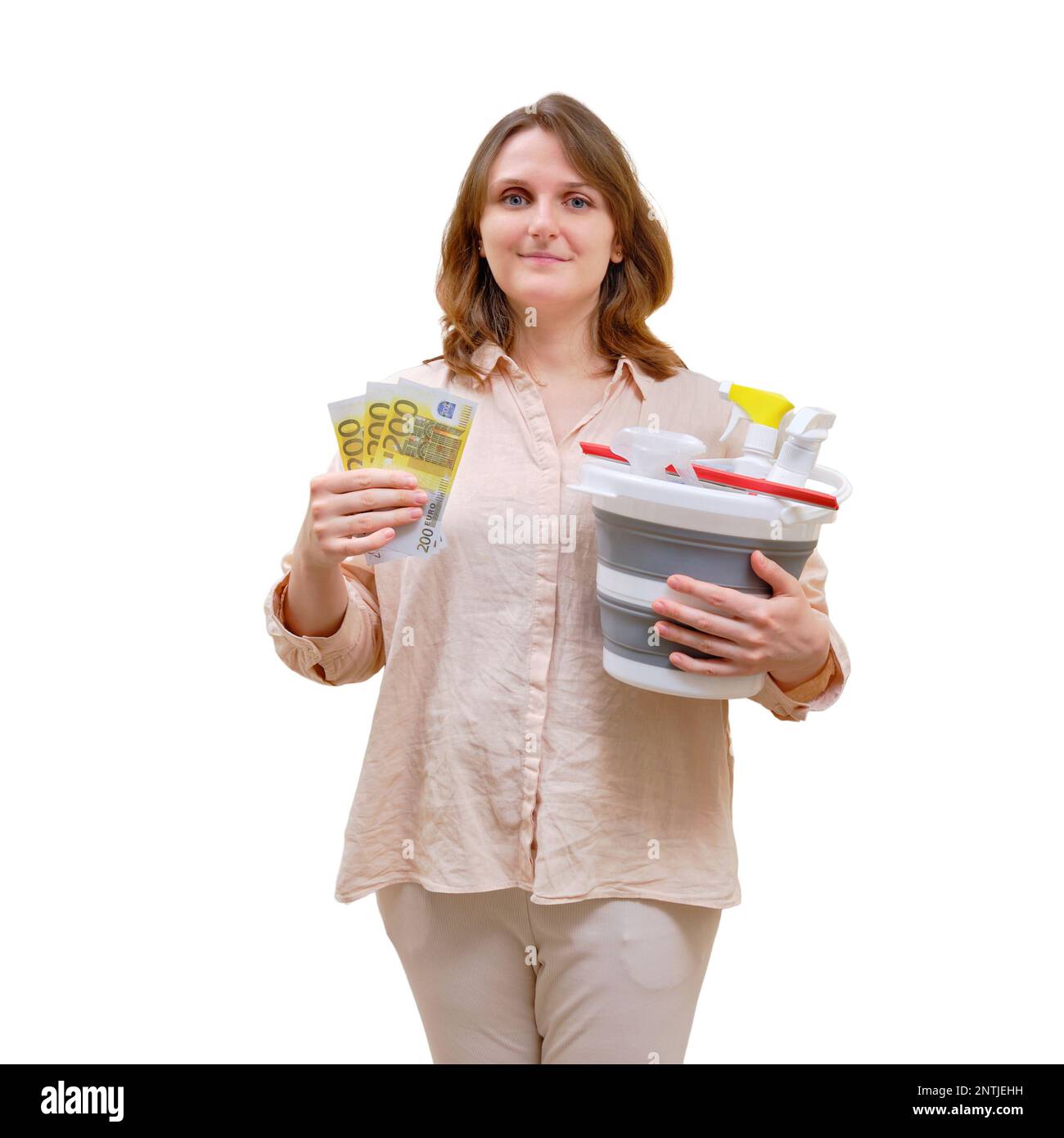 A woman smiles and holds money in euros when cleaning a home living ...
