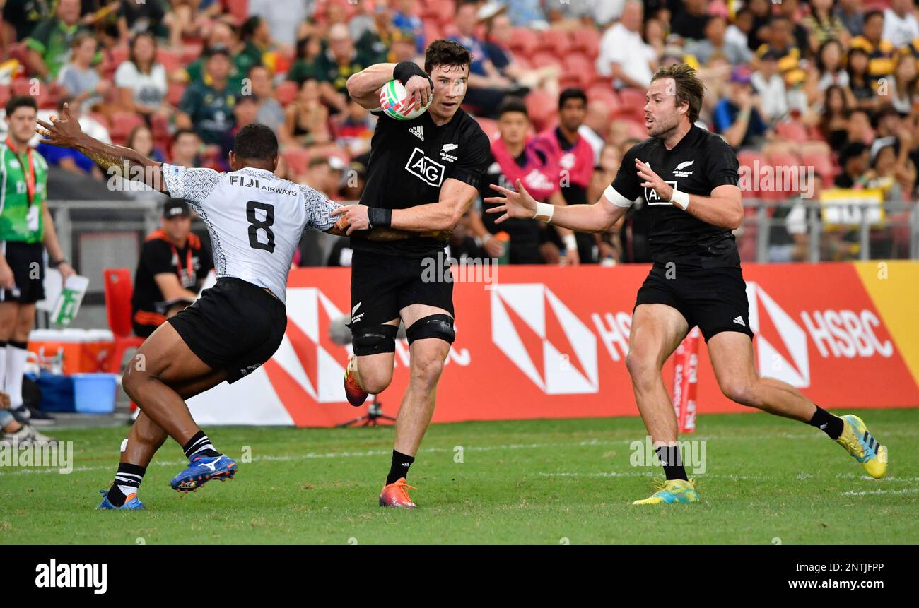 New Zealand's Sam Dickson cuts inside Fiji's Livai Ikanikoda during the ...
