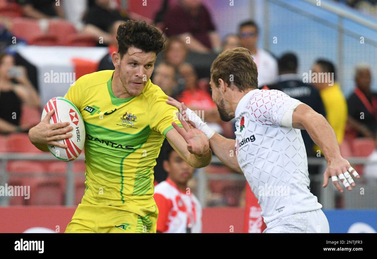 Australia's Simon Kennewell hands-off England's Tom Mitchell during the ...