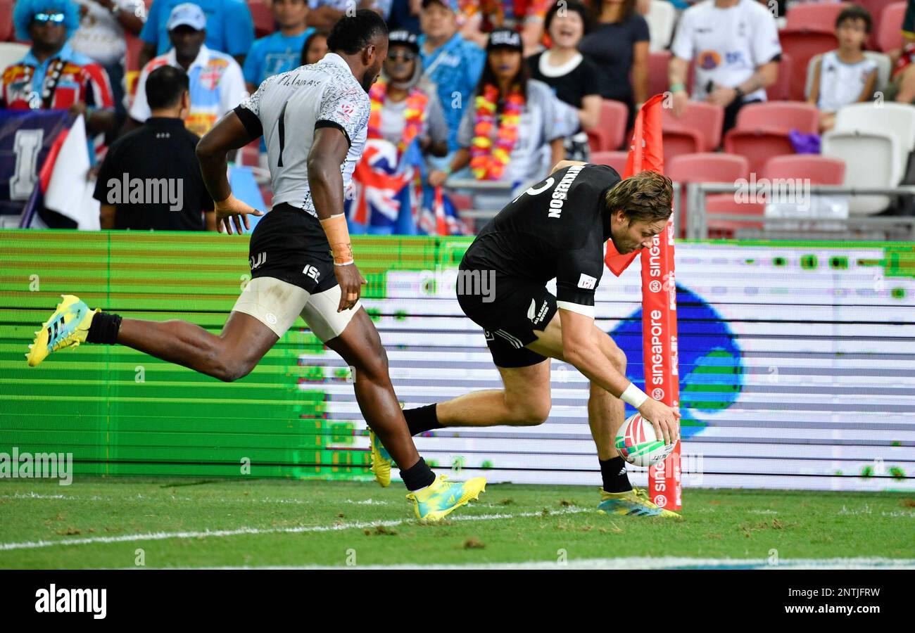 New Zealand's Tim Mikkelson scores i9n the corner during the HSBC ...