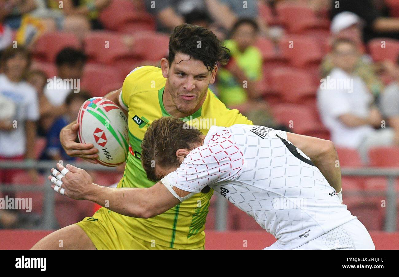 Australia's Simon Kennewell hands-off England's Tom Mitchell during the ...