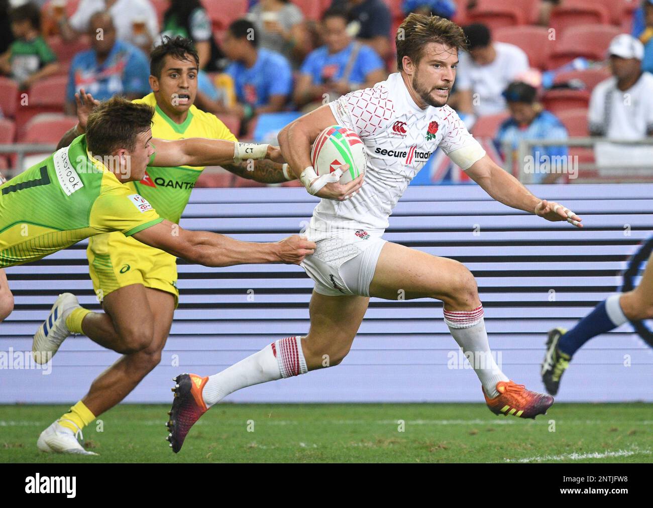 England's Tom Mitchell breaks past Australia's Joseph Pincus to score ...