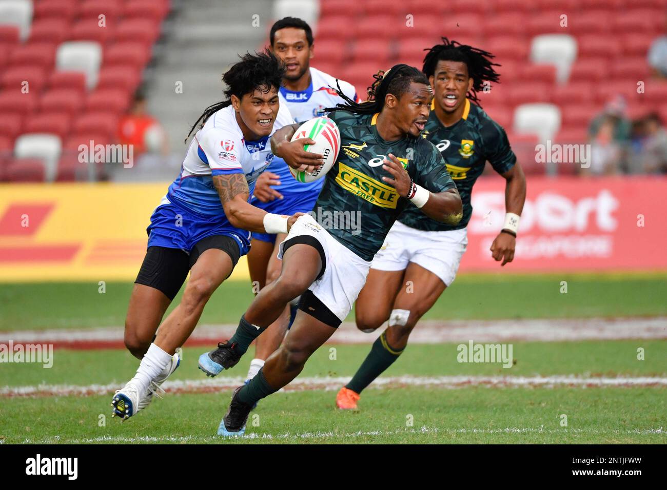 South Africa's Justin Geduld breaks past Samoa's John Vaili during the ...