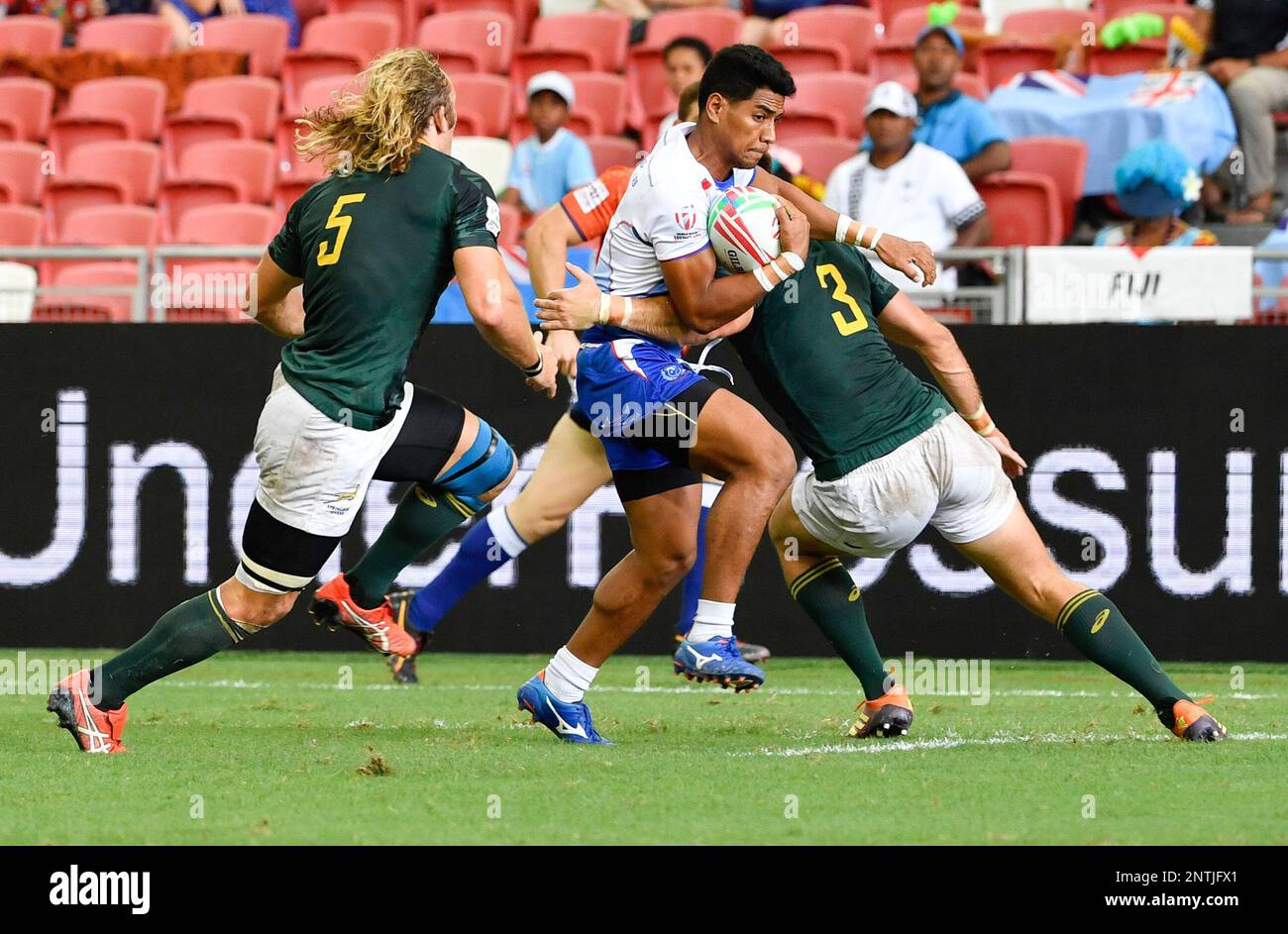 Samoa's Elisapeta Alofipo is stopped by South Africa's Impi Visser ...