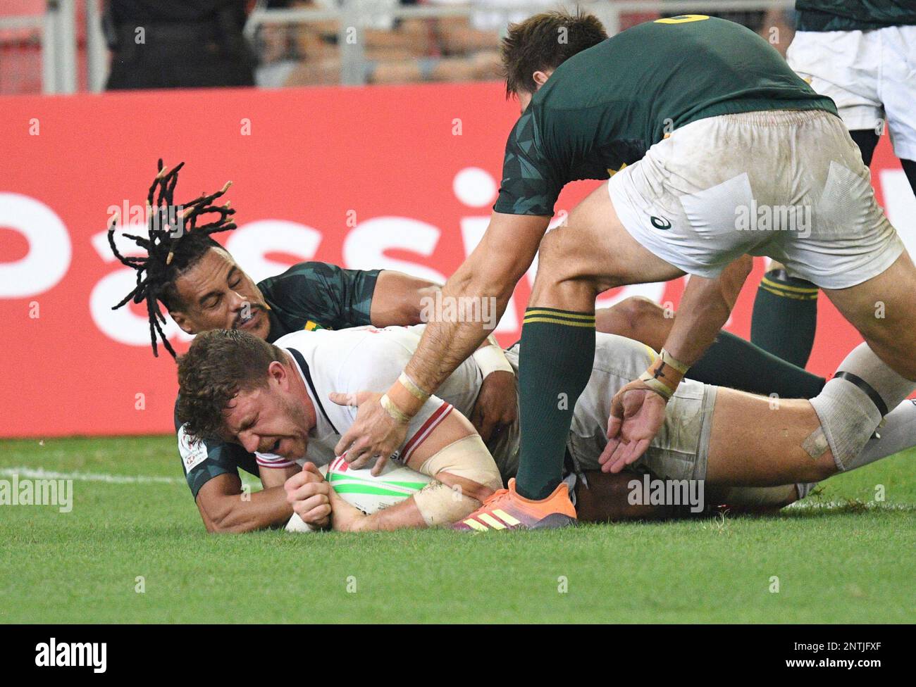 USA's Stephen Tomasin dives over to score during the HSBC Singapore ...