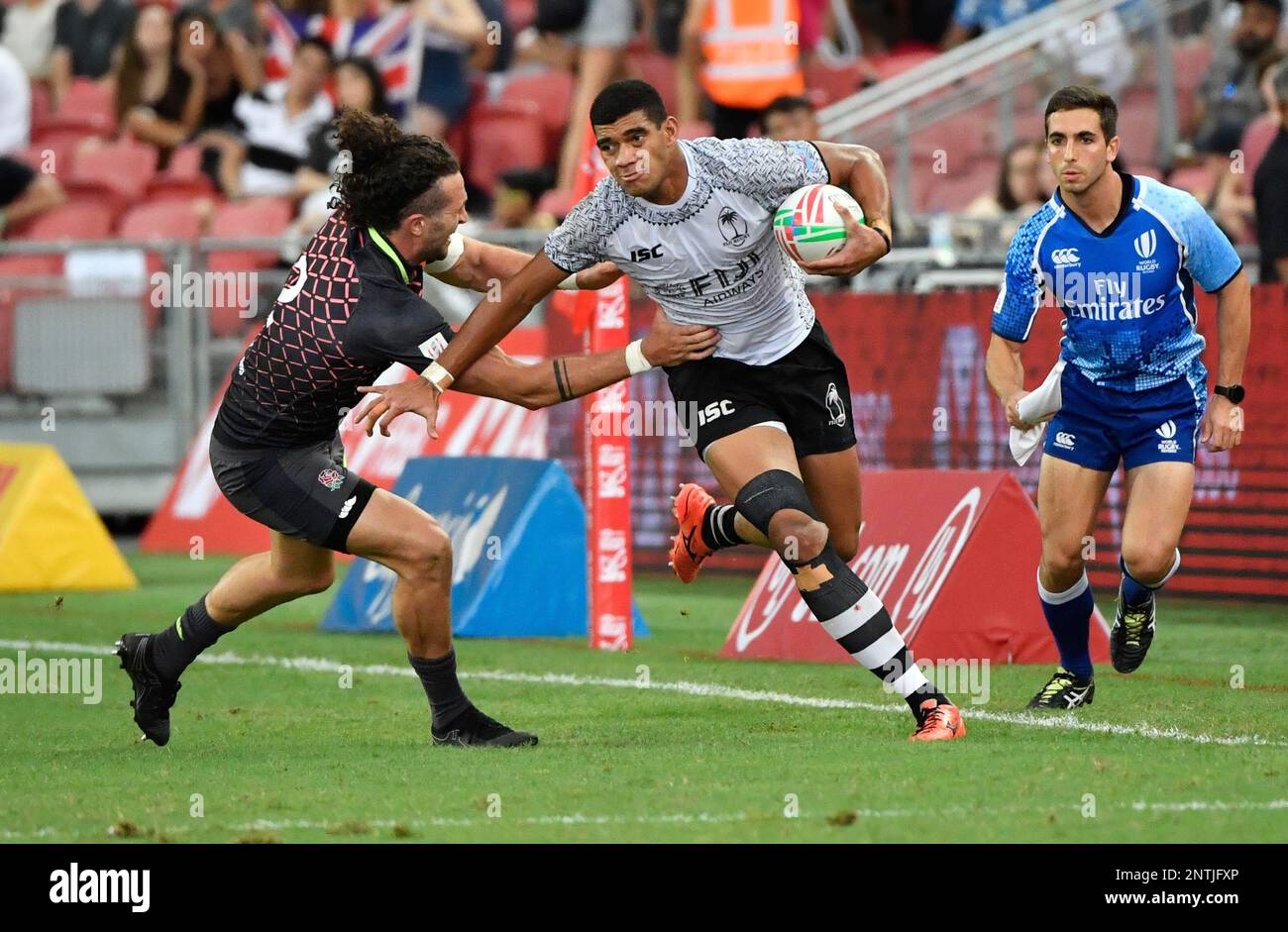 Fiji's Meli Derenalagi hands off England's Mike Ellery during the HSBC ...