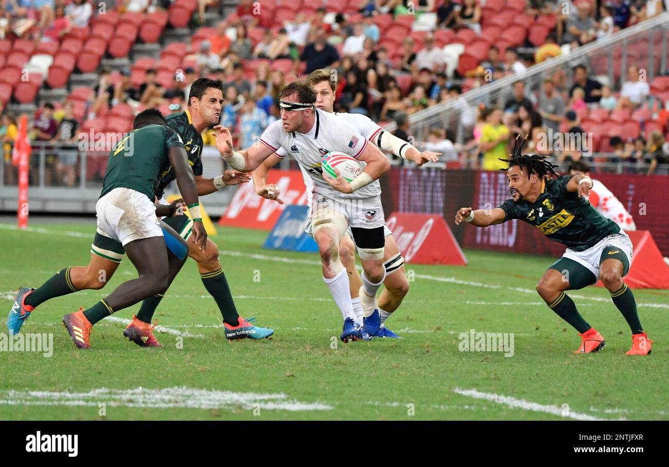 USA's Ben Pinkelman runs at the South Africa defence during the HSBC ...