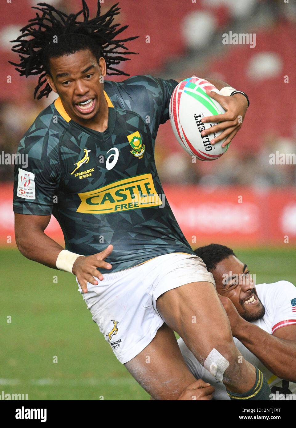 South Africa's Stedman Gans is tackled by USA's Matai Leuta during the ...