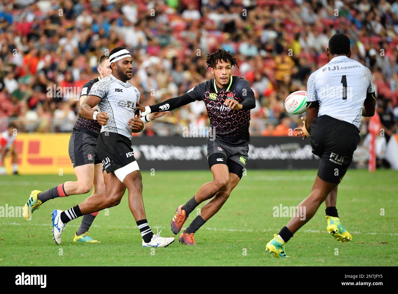 Fiji's Vilimoni Botitu passes to Fiji's Sevuloni Mocenacagi during his ...
