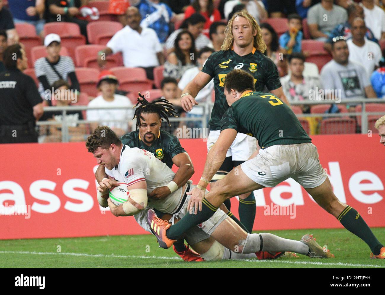 USA's Stephen Tomasin dives over to score during the HSBC Singapore ...