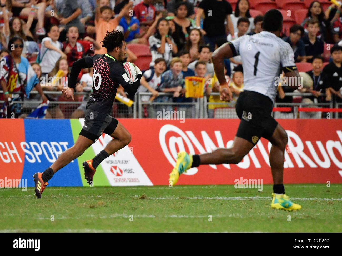 England's Ryan Olowofela makes break to score during the HSBC Singapore ...