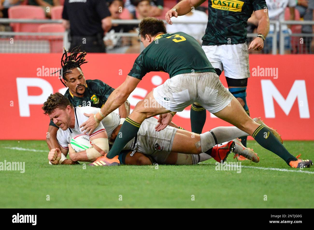 USA's Stephen Tomasin dives over to score during the HSBC Singapore ...