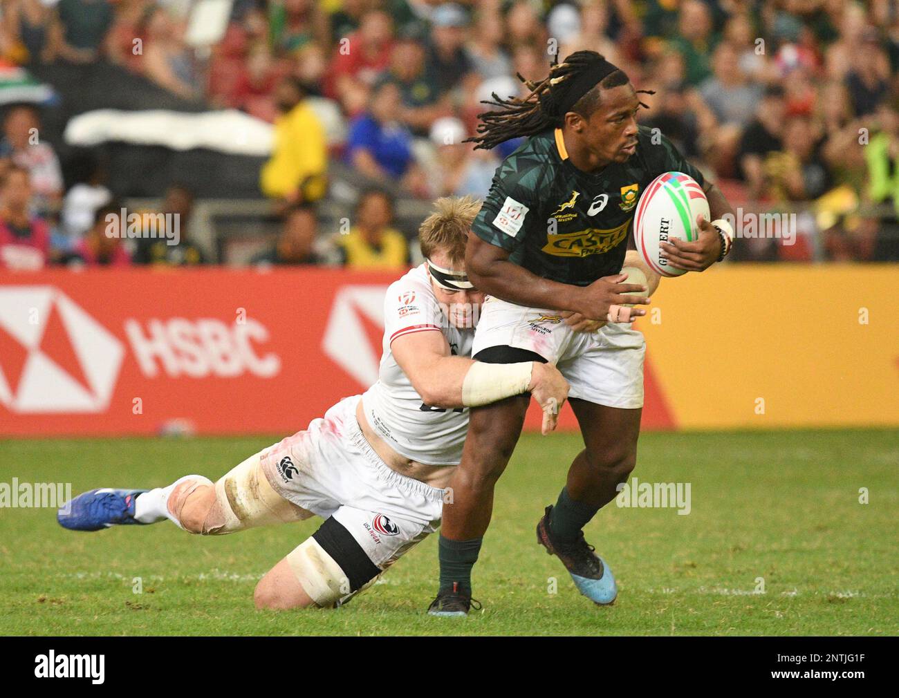 USA's Ben Pinkelman tackles South Africa's Branco du Preez during the ...