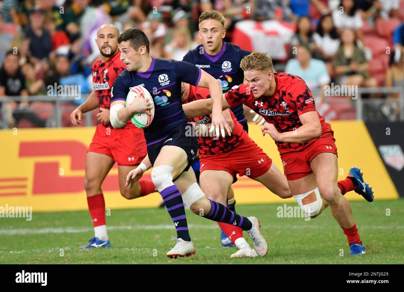 Scotland's Jamie Farndale breaks past Wales's Tom Rogers during the ...