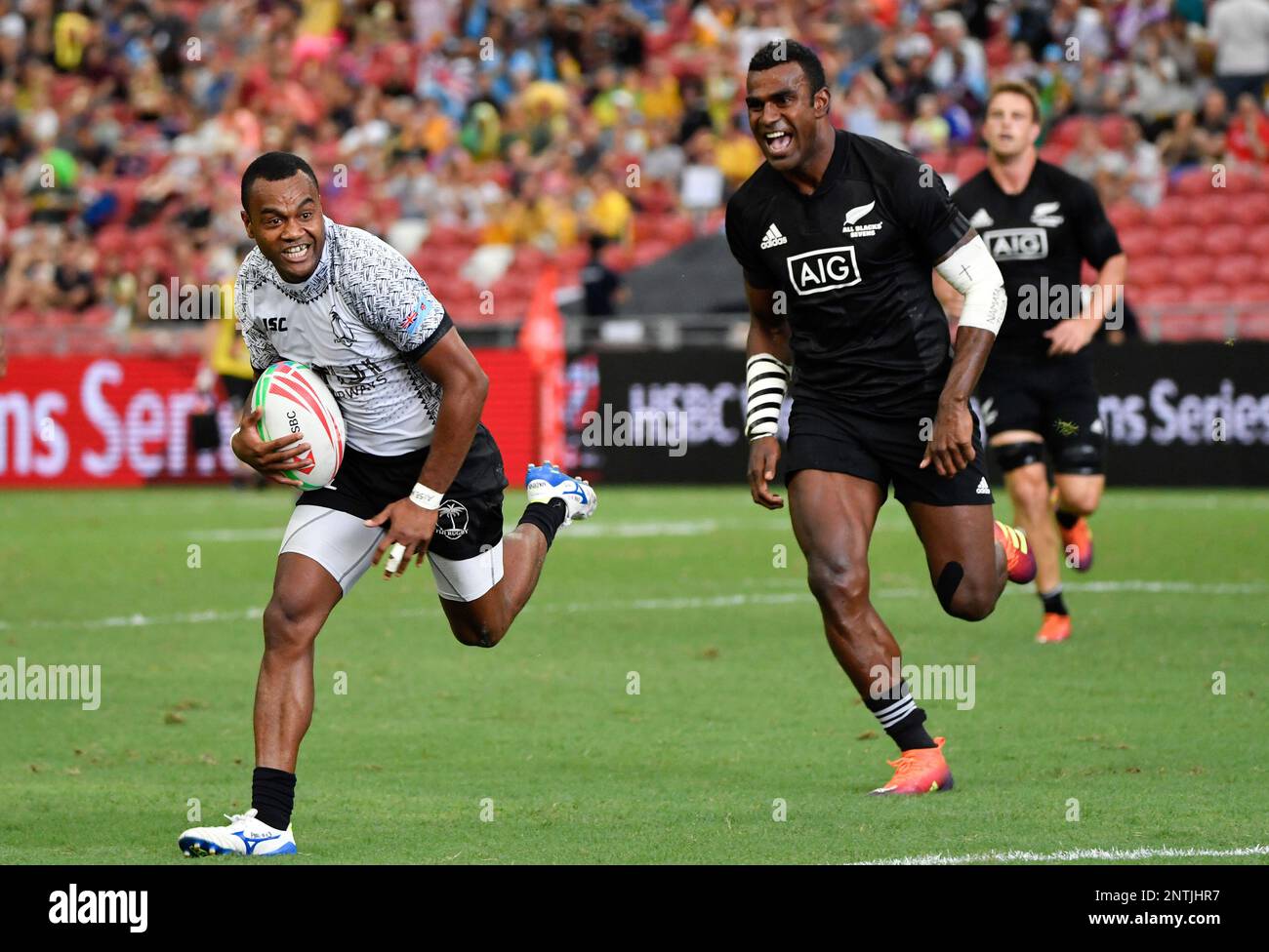 Fiji's Alasio Naduva makes break during the HSBC Singapore Rugby Sevens ...