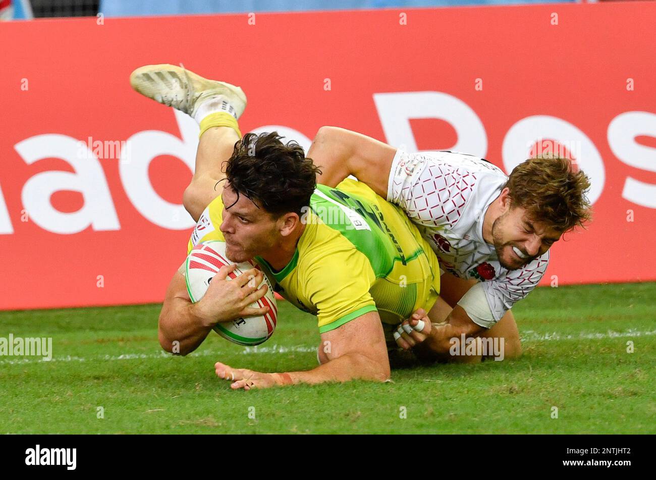 England's Tom Mitchell cannot stop Australia's Simon Kennewell from ...