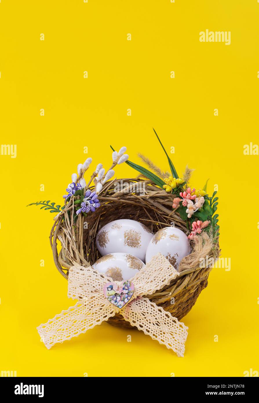 Easter, birthday poster with white golden eggs in nest with flower on ...