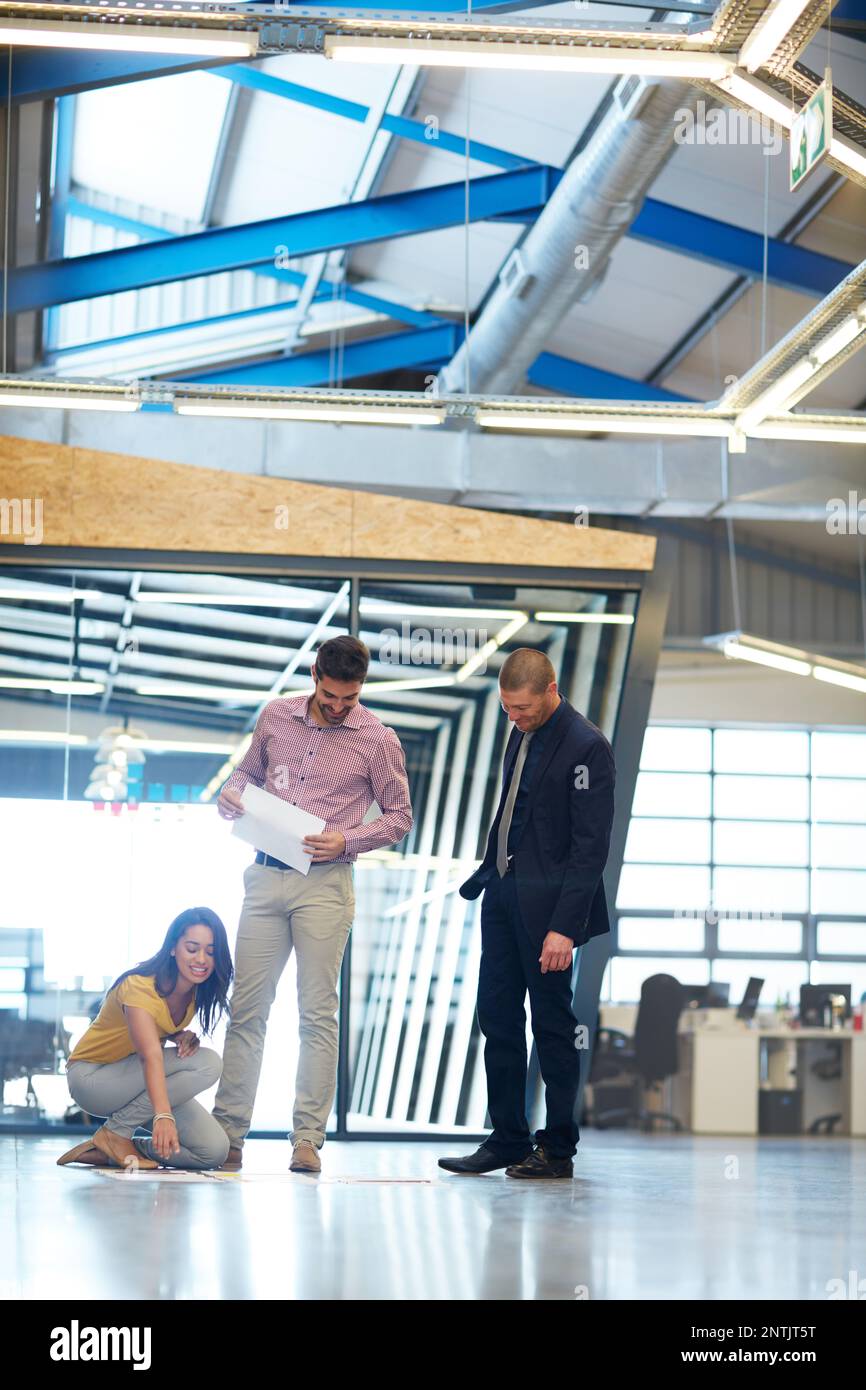 The beginning stages of planning. Full length shot of three ...