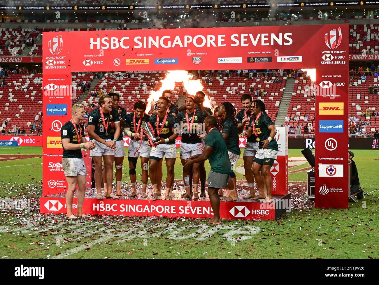 South Africa celebrate with the trophy after their victory by 20-19 during the HSBC Singapore ...