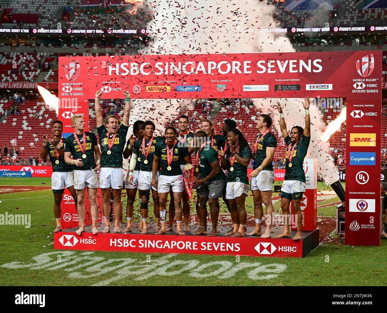 South Africa celebrate with the trophy after their victory by 20-19 during the HSBC Singapore ...