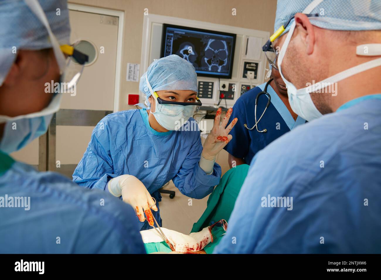Taking charge of a surgical procedure. a team of surgeons performing a ...