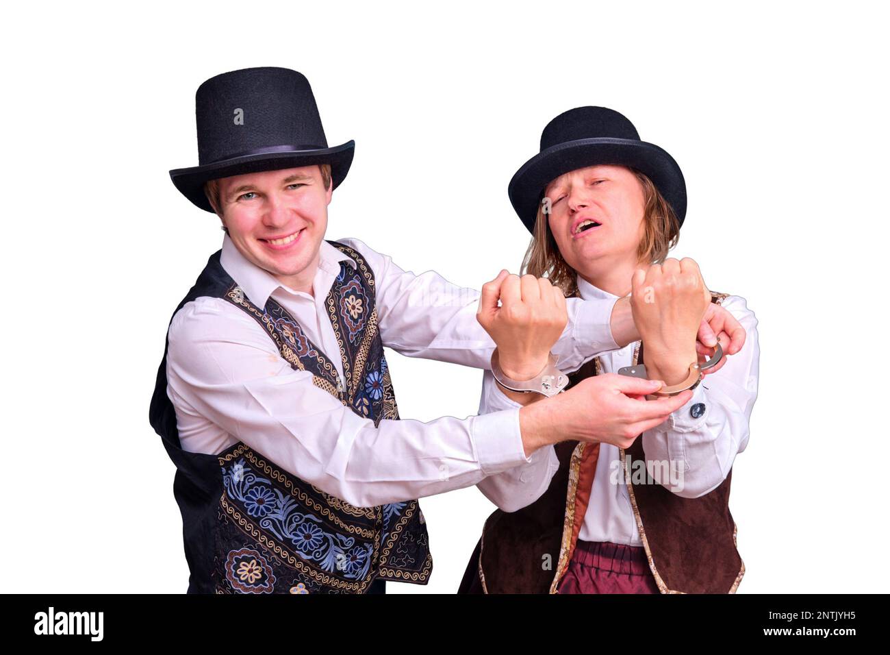 Man and woman magicians with handcuffs on isolated on a white ...