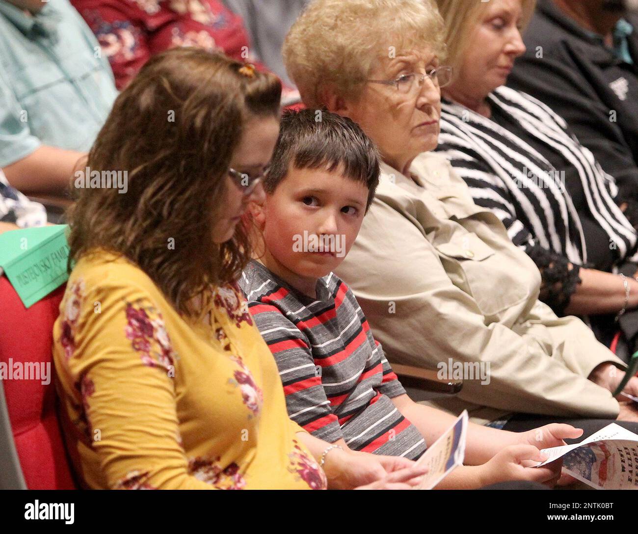 Parker Pustejovsky looks over to his mother Lindsey Vanek, during a ...
