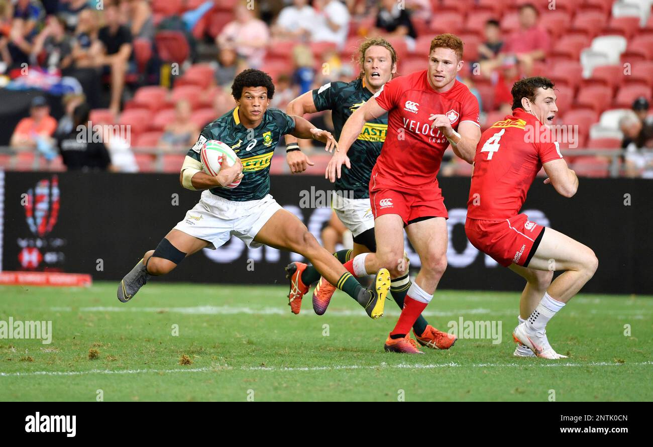 South Africa's Kurt-Lee Arendse makes a big step around the Canada ...