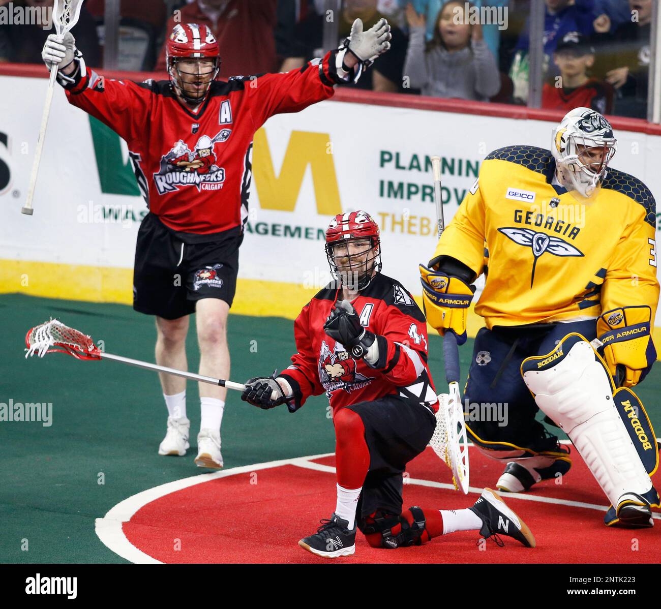 Calgary Roughnecks player Dane Dobbie, ctr, celebrates with Curtis ...