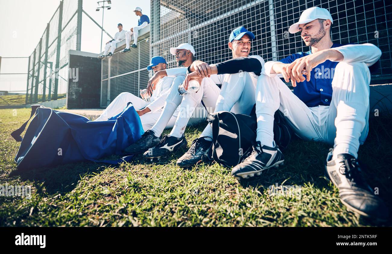 Baseball team, sitting and grass for training, relax and conversation ...