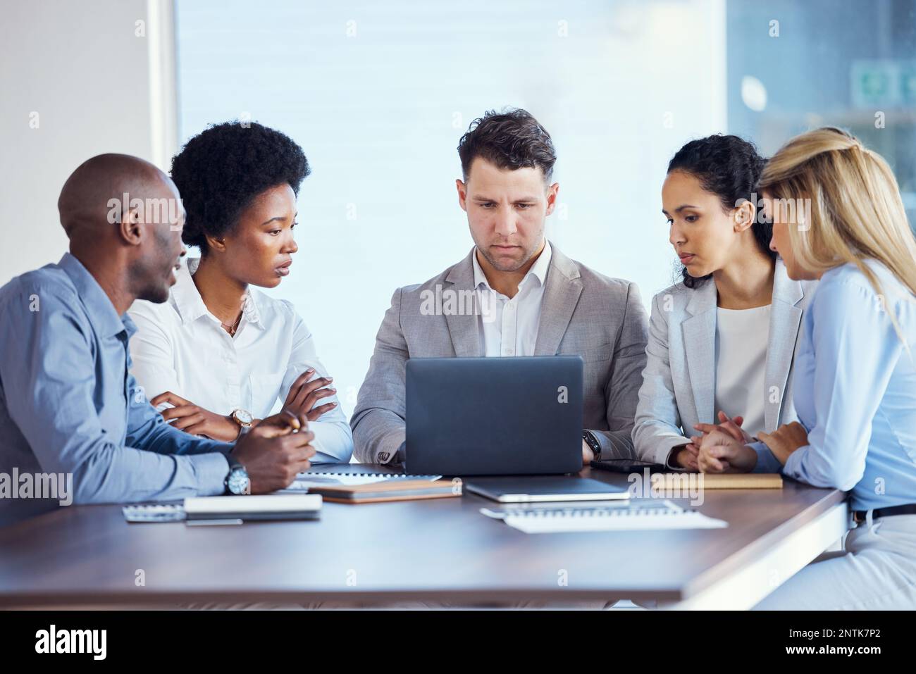 Meeting, focus and business people on laptop in office for planning, marketing strategy and ...