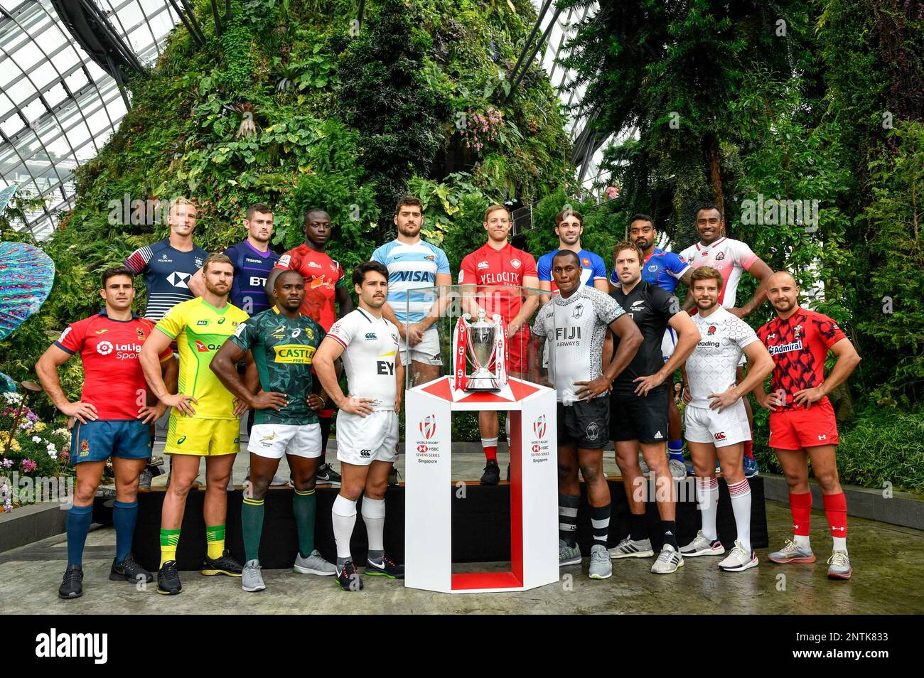 The team captains from all nations competing pose with the trophy ...