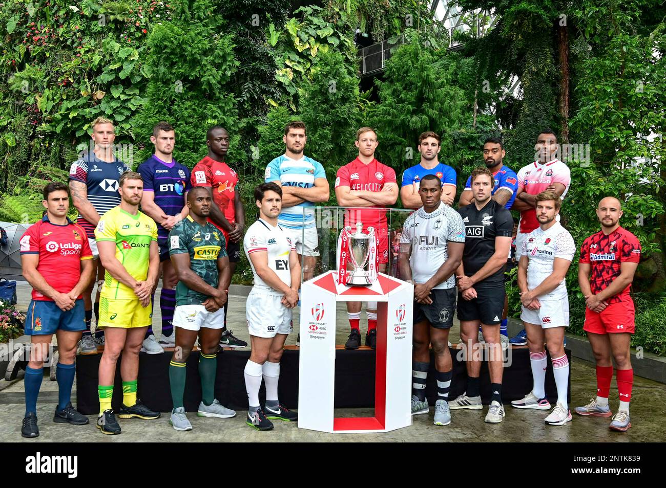 The team captains pose with the trophy during the HSBC Singapore Rugby ...