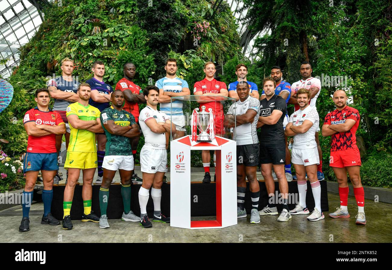 The team captains from all nations competing pose with the trophy ...